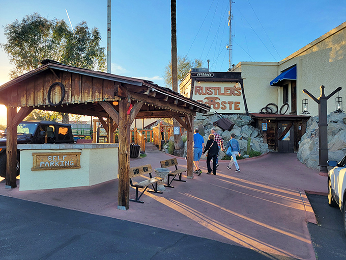 The welcoming entrance path leads visitors into a Wild West adventure – complete with rustic wooden structures and the promise of frontier hospitality ahead.