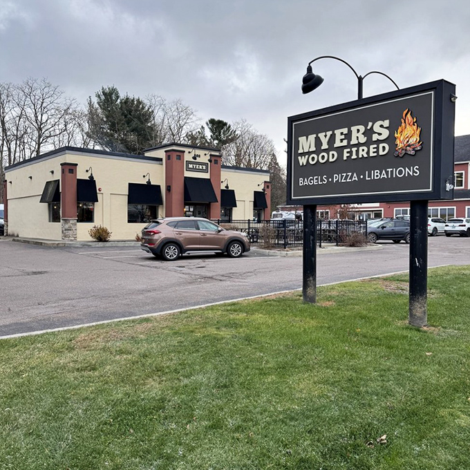 The promise of bagel bliss: Myer's exterior sign proudly announces its wood-fired trifecta of "Bagels &bull; Pizza &bull; Libations" to hungry passersby.