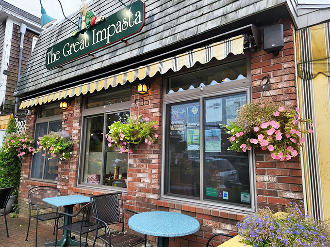 Striped awnings and flower boxes frame the entrance, giving passersby a hint of the warm Italian welcome that awaits inside.