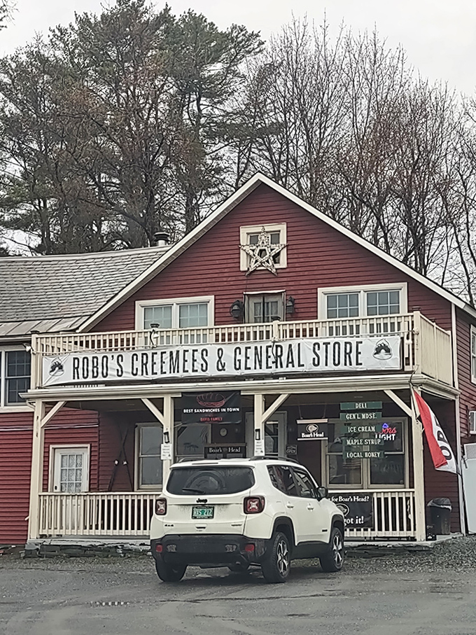 Even in winter's bare-branched beauty, Robo's red exterior promises warmth and comfort to travelers navigating Vermont's snowy landscape.