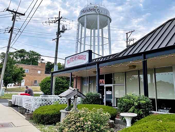 The Mundelein water tower visible beyond Taste of Paris creates a charming juxtaposition &ndash; French cuisine with Midwestern roots.