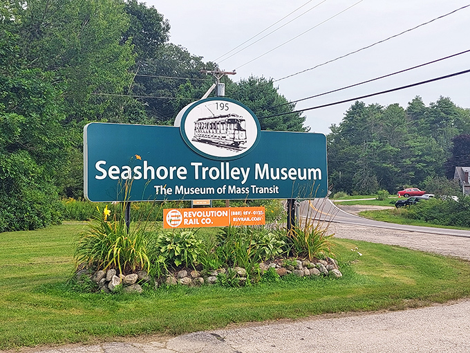 The museum's sign welcomes visitors to the world's oldest and largest electric railway museum, a hidden gem nestled in the beautiful Maine countryside.