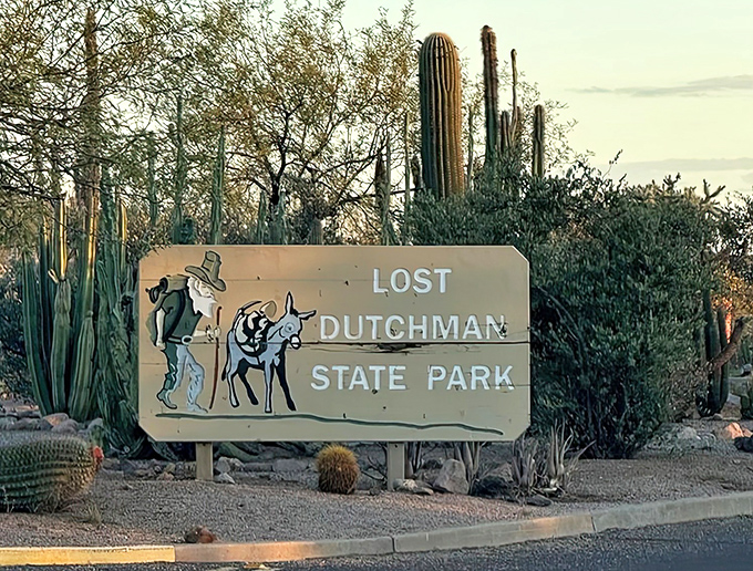 The iconic entrance sign welcomes visitors to a land of legend and beauty, where a prospector and his trusty burro still search for elusive gold.