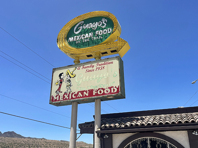 The golden arrow points to culinary treasure &ndash; Guayo's distinctive signage has been guiding hungry travelers to Mexican food paradise for generations.