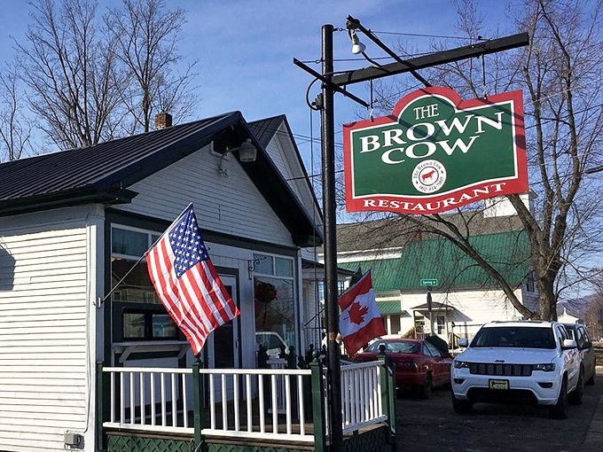 The iconic Brown Cow sign stands as a beacon for hungry travelers and locals seeking breakfast perfection.