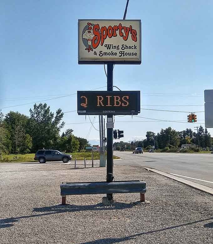 The roadside sign beckons travelers with promises of wings and ribs, a siren call that's impossible for hungry drivers to resist.