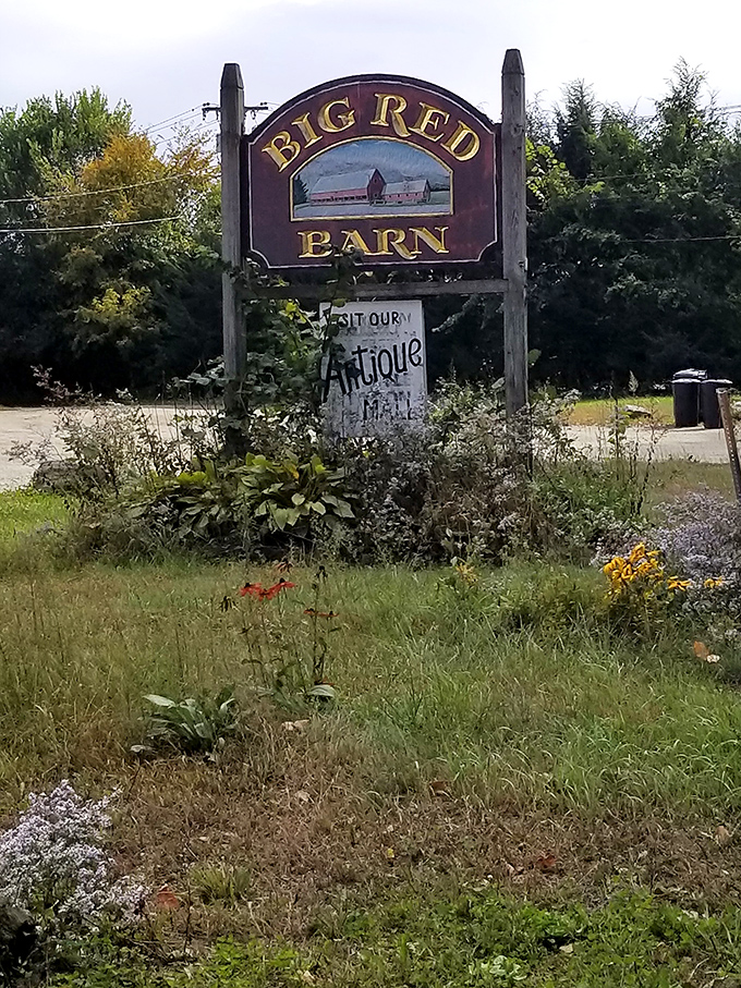 The hand-painted sign stands sentinel at the roadside, guiding travelers to this cathedral of collectibles and vintage treasures.