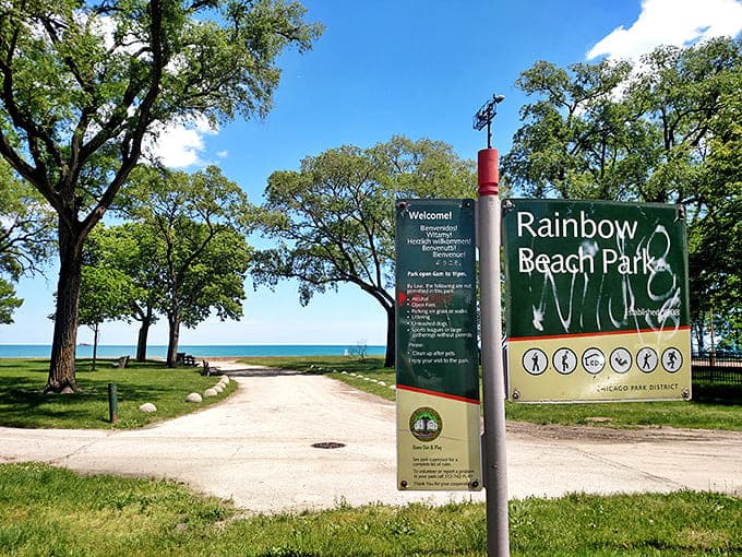 The Country Charm sign, surrounded by seasonal blooms, makes a simple promise that the restaurant absolutely keeps.