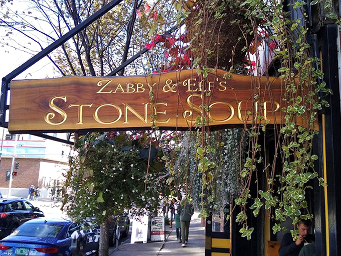 Vines frame the iconic wooden sign, creating a storybook entrance to this beloved Burlington institution that feels both timeless and perfectly of-the-moment.