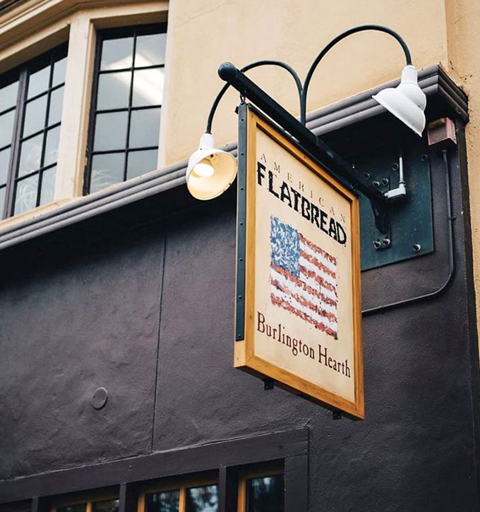 That sign says it all&mdash;American Flatbread celebrates both national pride and local craft in one perfectly lit emblem above the street.