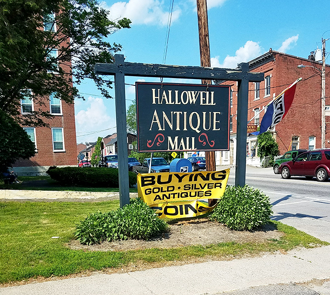The Hallowell Antique Mall sign stands as a beacon for treasure hunters, promising discoveries that big-box stores could never deliver.