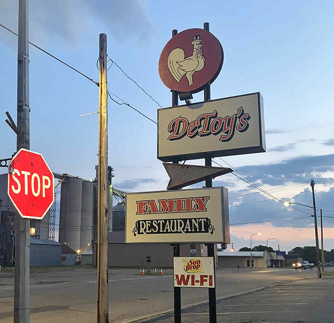 The iconic rooster sign stands tall against the Minnesota sky, a beacon guiding hungry travelers to hash brown heaven.