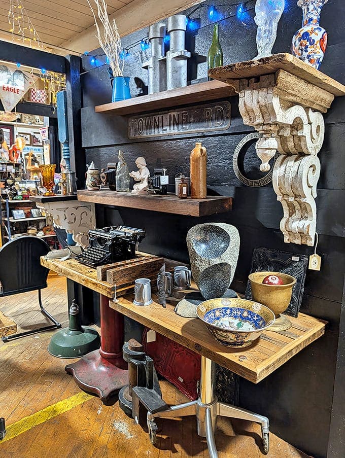 Vintage typewriters and architectural salvage create a vignette that's part office, part art installation. That "Townline Rd" sign has stories to tell about journeys taken.