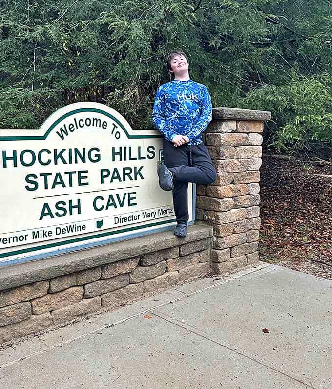 The official welcome sign becomes a photo opportunity, marking the threshold between everyday life and natural wonder.