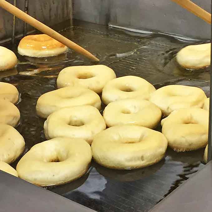The behind-the-scenes alchemy where simple rings of dough transform into golden circles of joy in bubbling oil.