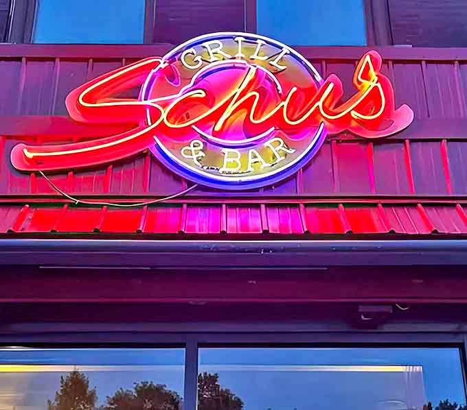 The iconic neon sign glows invitingly against the twilight sky, a beacon for hungry travelers and locals alike seeking authentic Michigan flavor.