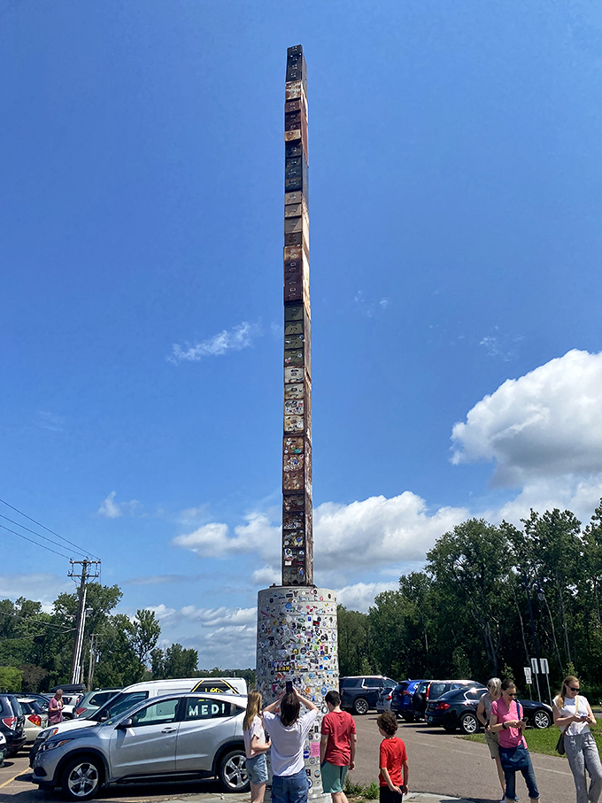 Against a brilliant blue sky, the World's Tallest Filing Cabinet stretches skyward like an office supply skyscraper gone rogue.