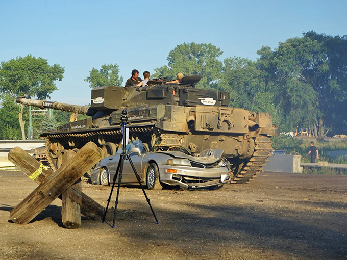 Tanks for the memories! This behemoth's about to turn a car into a pancake. Who needs therapy when you can crush cars?