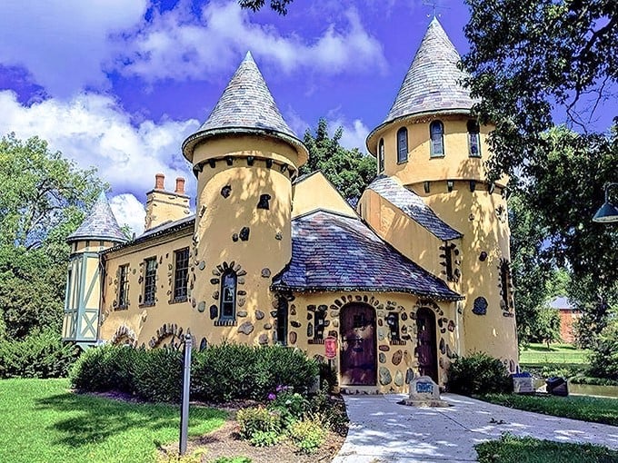Stone accents and pointed towers give this bright yellow castle a fairy tale quality that stands out in Michigan's landscape.