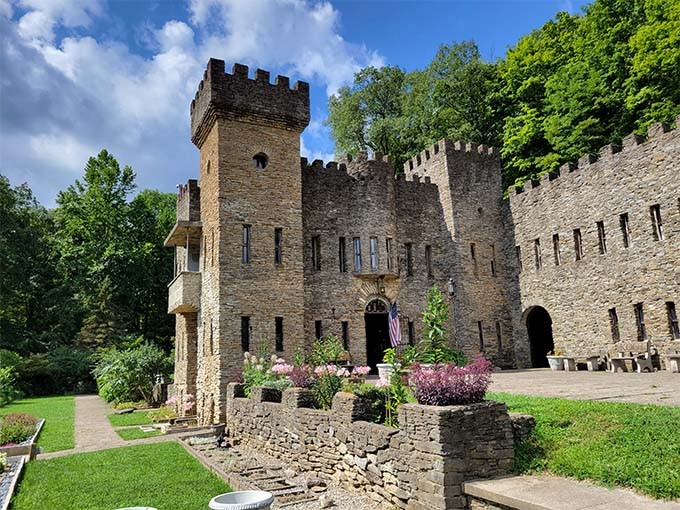 The castle's impressive stonework and crenellated walls transport visitors to another time, standing proudly against a brilliant blue Ohio sky.