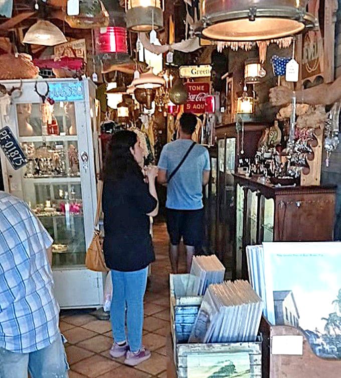 Treasure hunters navigate narrow aisles packed with history, where strangers become friends over shared discoveries and whispered recommendations.