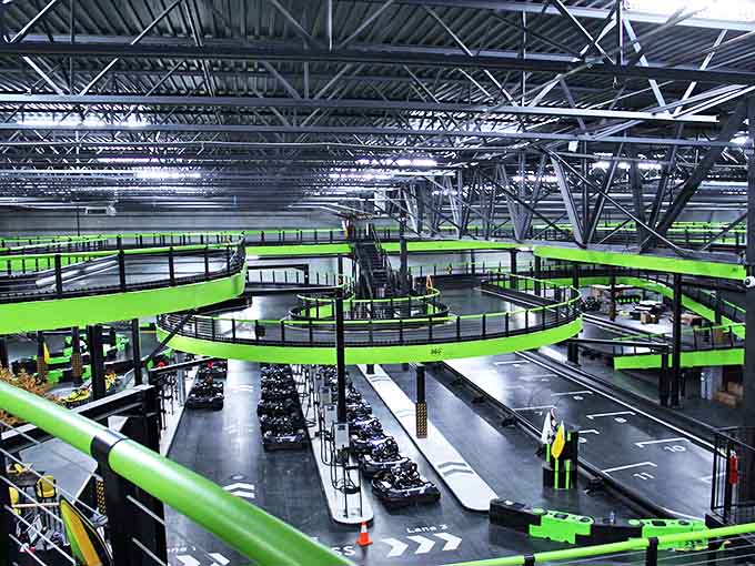 Looking down at the multi-level track from above feels like watching a choreographed dance of speed demons &ndash; organized chaos at its finest.