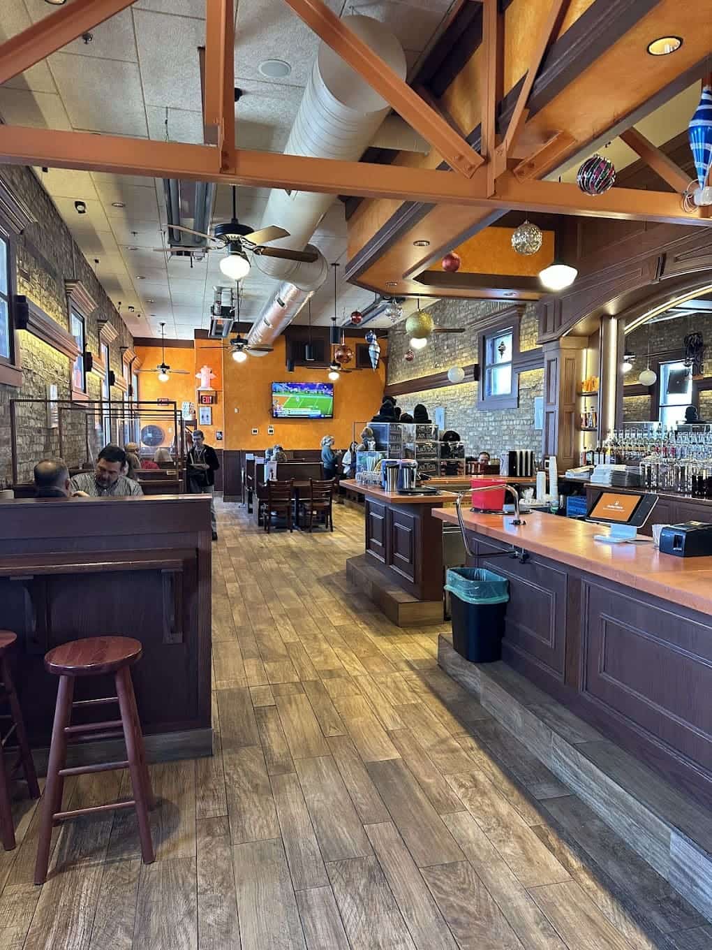 Step inside to discover warm wooden beams and cozy booths where sweet potato fry dreams come true alongside world-class barbecue.