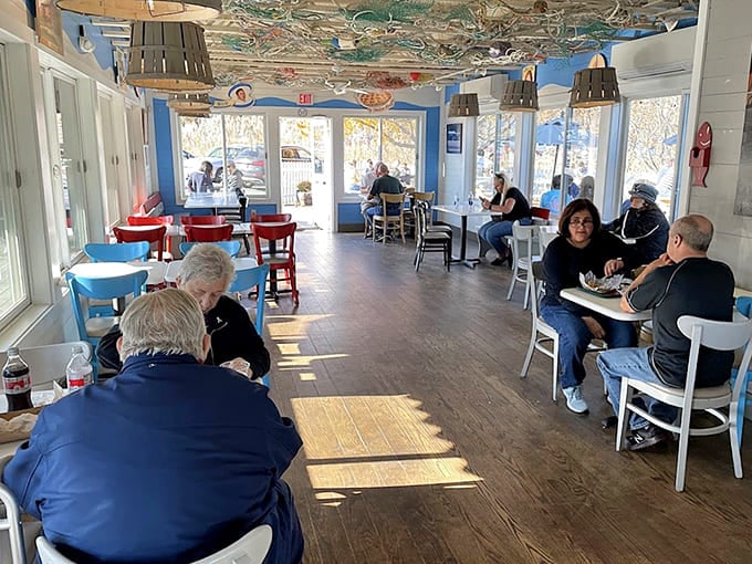 Bright, nautical-themed dining room where locals and tourists unite over their shared love of perfectly fried seafood.