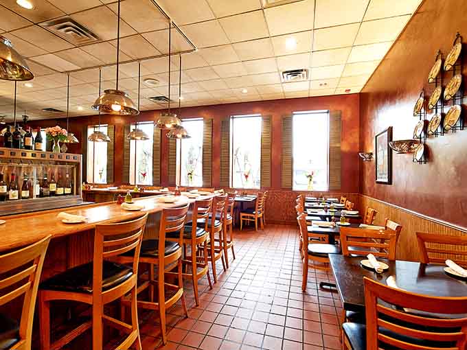 Warm wood tones and pendant lights create the kind of atmosphere where you actually want to linger over dinner instead of rushing out.