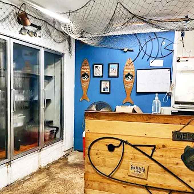 Inside, nautical charm meets culinary seriousness &ndash; fishing nets overhead while the counter below prepares to serve up Lake Superior's finest catches.