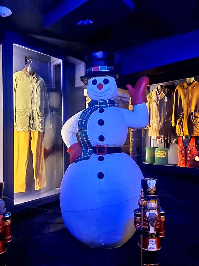 This jolly snowman greets visitors with a wave and a smile, standing guard over treasures of Christmas past in his illuminated blue glory.