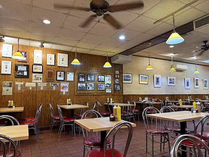 Wood paneling and vintage photos create a time-capsule dining room where comfort food meets decades of cherished memories and tradition.
