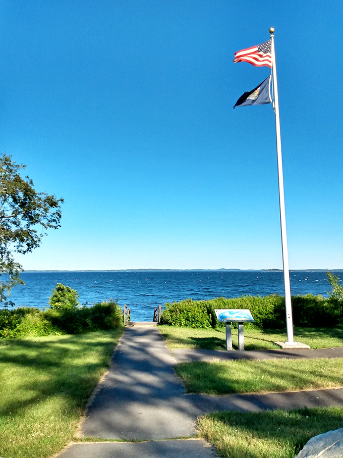 Old Glory waves proudly against Maine's impossibly blue sky, welcoming visitors to one of the state's most underappreciated coastal treasures.