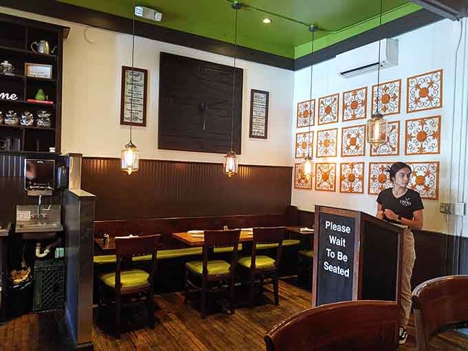 Inside Crema, warm wood tones and decorative tile work create an atmosphere that's equal parts cozy caf&eacute; and sophisticated eatery.