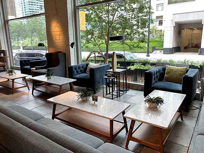 Plush seating and natural light create the perfect spot to linger over breakfast, because rushing through a great croissant sandwich should be illegal.