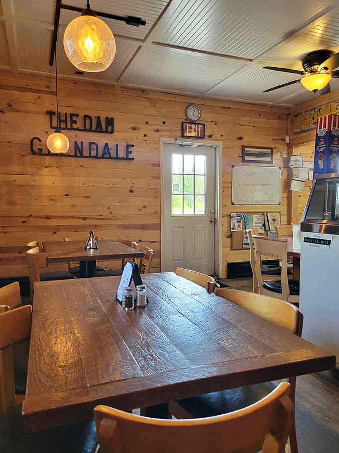 Wood-paneled walls and cozy seating create the kind of welcoming atmosphere where strangers become friends over exceptional meals.