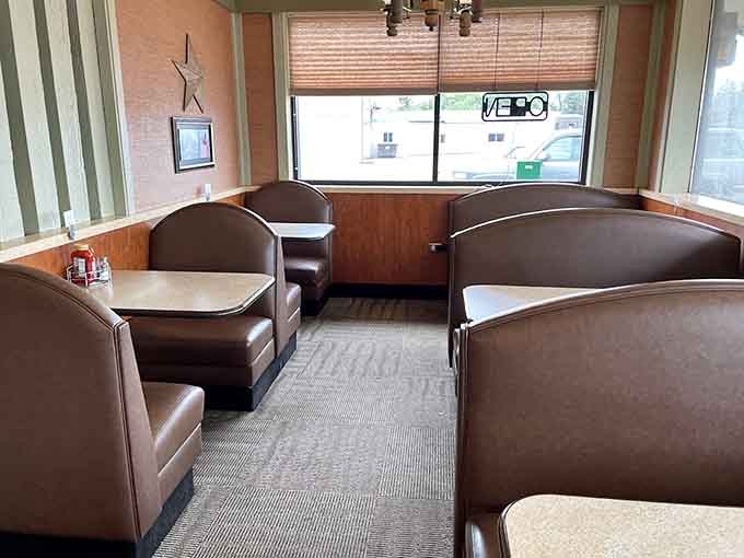 Classic booth seating and warm wood tones create the perfect backdrop for serious eating and even more serious conversation.