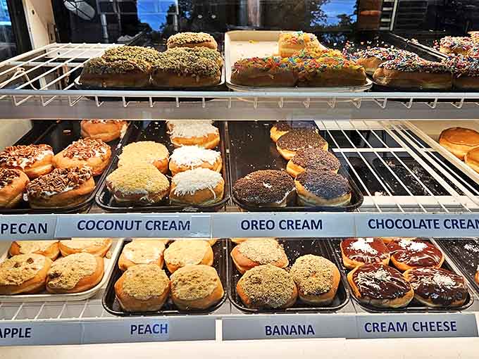Donut Display: A treasure trove of potato-flour perfection awaits behind glass, each variety more tempting than the last.