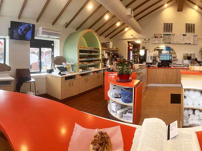 Step inside and you're greeted by bright orange counters that refuse to apologize for being cheerful and a layout that says "welcome home."