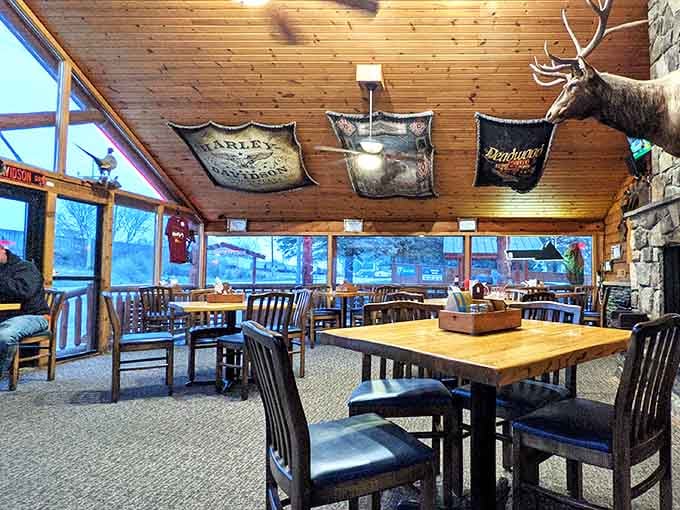 Wood paneling, mounted wildlife, and rustic charm create an atmosphere that feels like home, assuming your home is this cool.