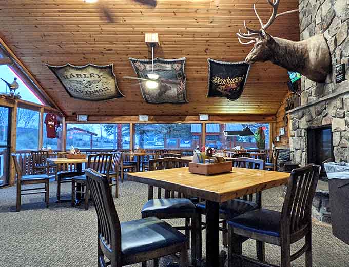 Warm wood tones and hunting lodge vibes create the perfect backdrop for serious burger consumption and casual conversation.