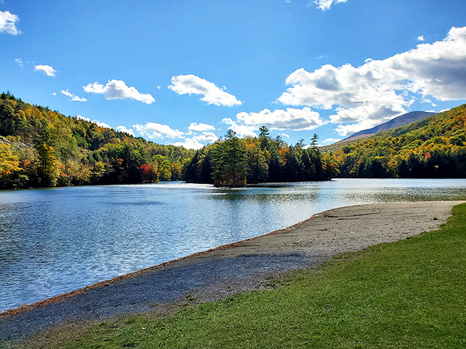Fall transforms Emerald Lake into nature's mirror, doubling the visual impact of Vermont's legendary foliage against crystal clear waters.