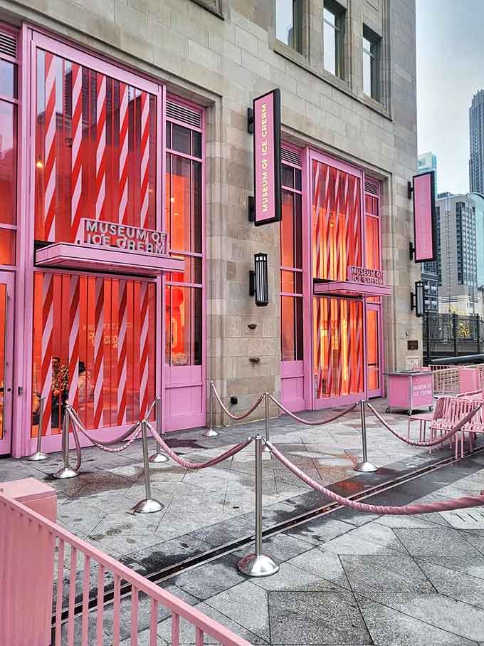 The entrance beckons with vibrant pink doors and windows, promising sweet adventures beyond the ordinary museum experience.