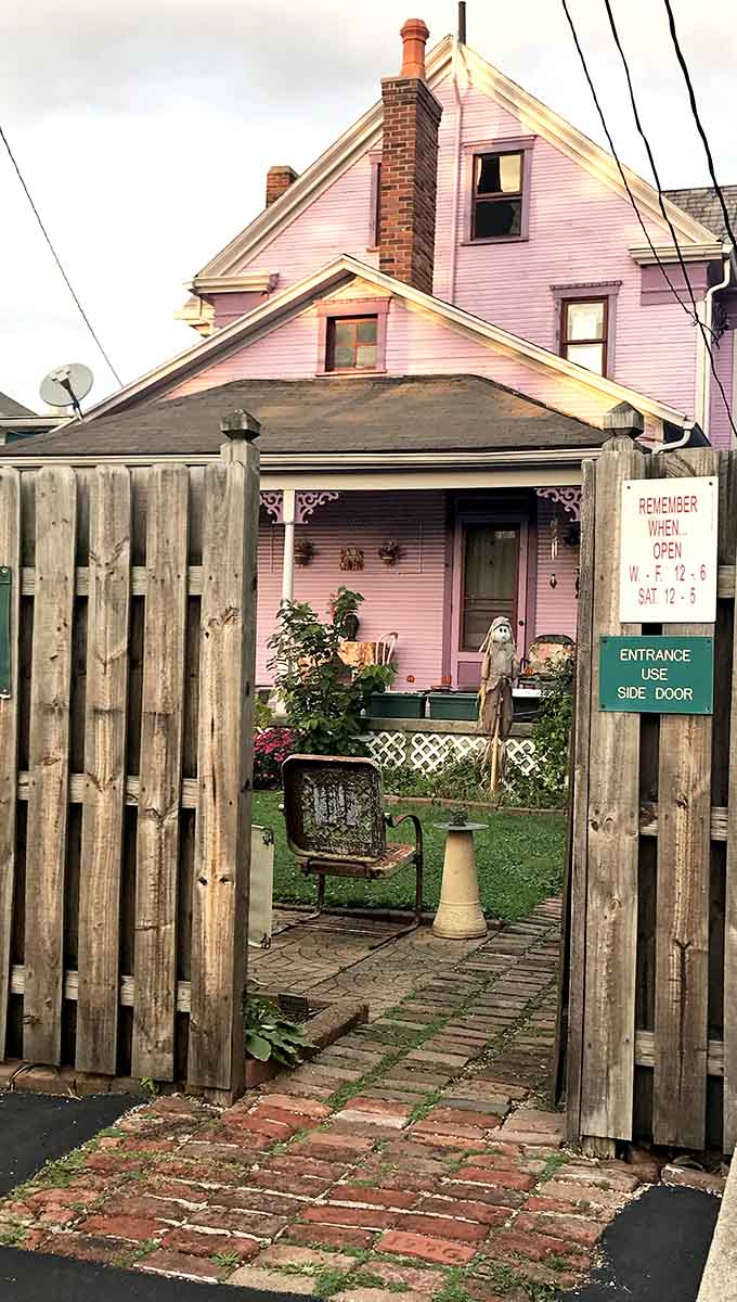 Twinkling lights guide visitors along the entrance path, creating an enchanting welcome that hints at the magic within.