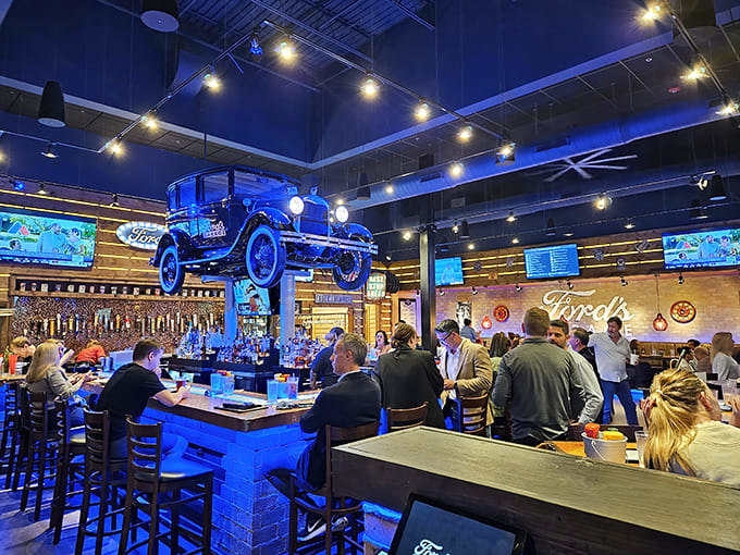Inside, a vintage Ford hovers magically above the bustling bar, where craft beers flow from gas pump taps amid the happy hum of satisfied diners.