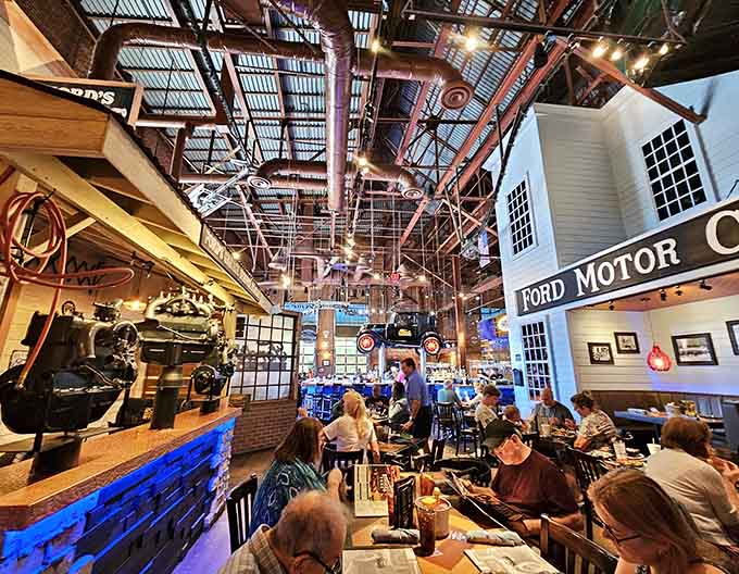 Inside Ford's Garage, families gather beneath industrial rafters and automotive memorabilia, creating memories in this cathedral to car culture.