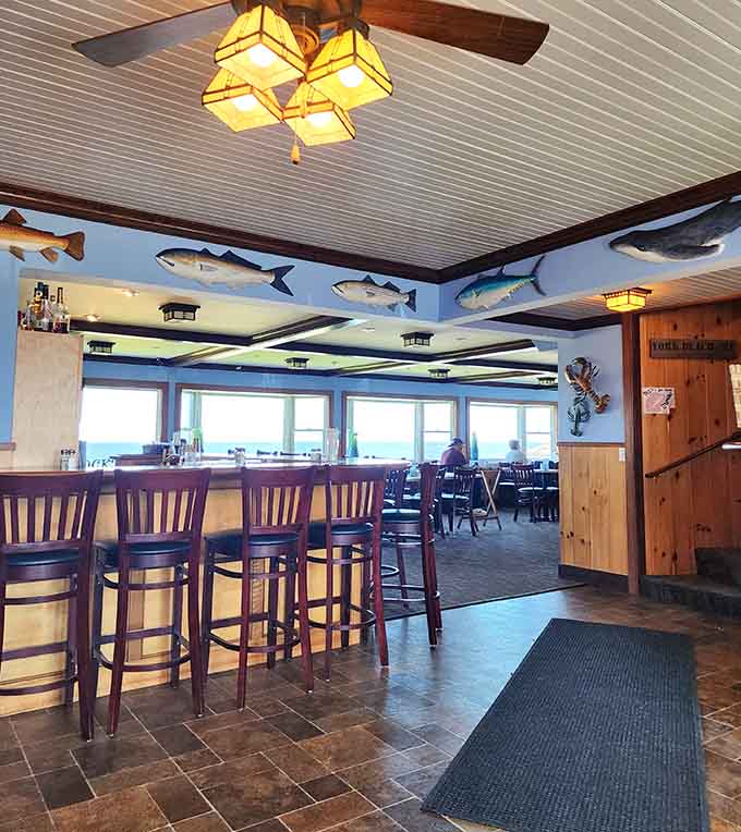 Inside Fox's, the nautical decor and ocean views create an atmosphere where even the fish on the walls look happy.