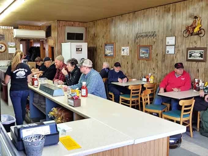 Wood paneling that would make your grandparents nostalgic meets counter seating where the coffee never stops flowing and the conversation never gets old.
