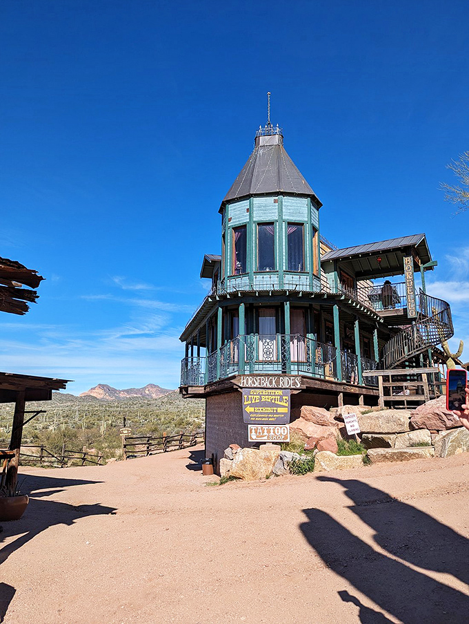 This turquoise-trimmed lookout tower offers panoramic views of the desert landscape, perfect for spotting outlaws or lost treasures.