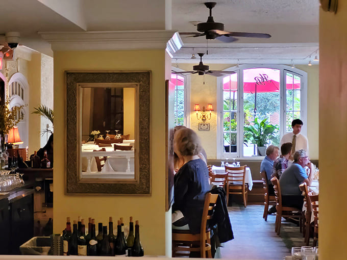 Step inside to discover an intimate dining room where warm lighting and crisp linens create an atmosphere that's both elegant and wonderfully welcoming.